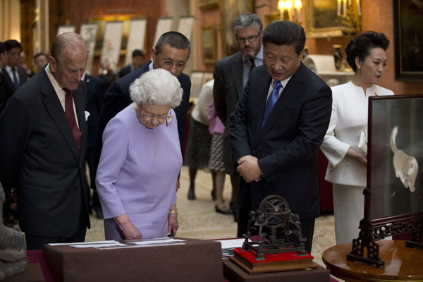 Pomp and protests as China's Xi meets Queen Elizabeth II - Business ...