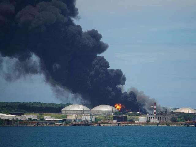 Third oil storage tank collapses in Cuba terminal following fire, spill ...