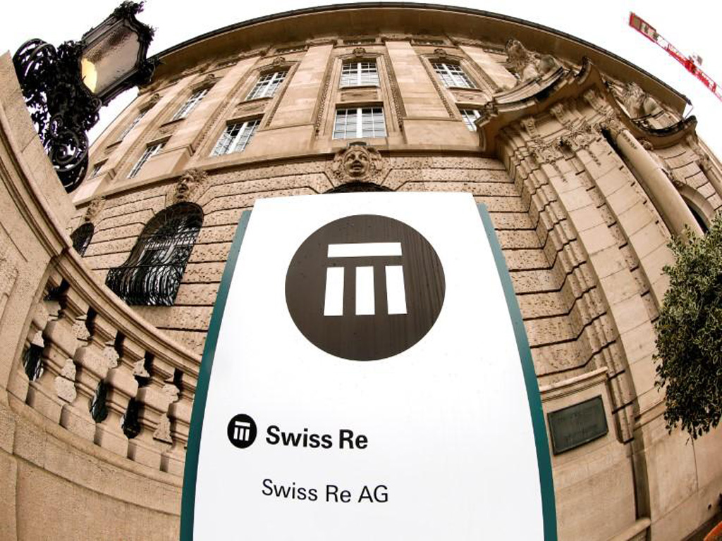 Hurricanes push Swiss Re into red in first nine months - Business ...